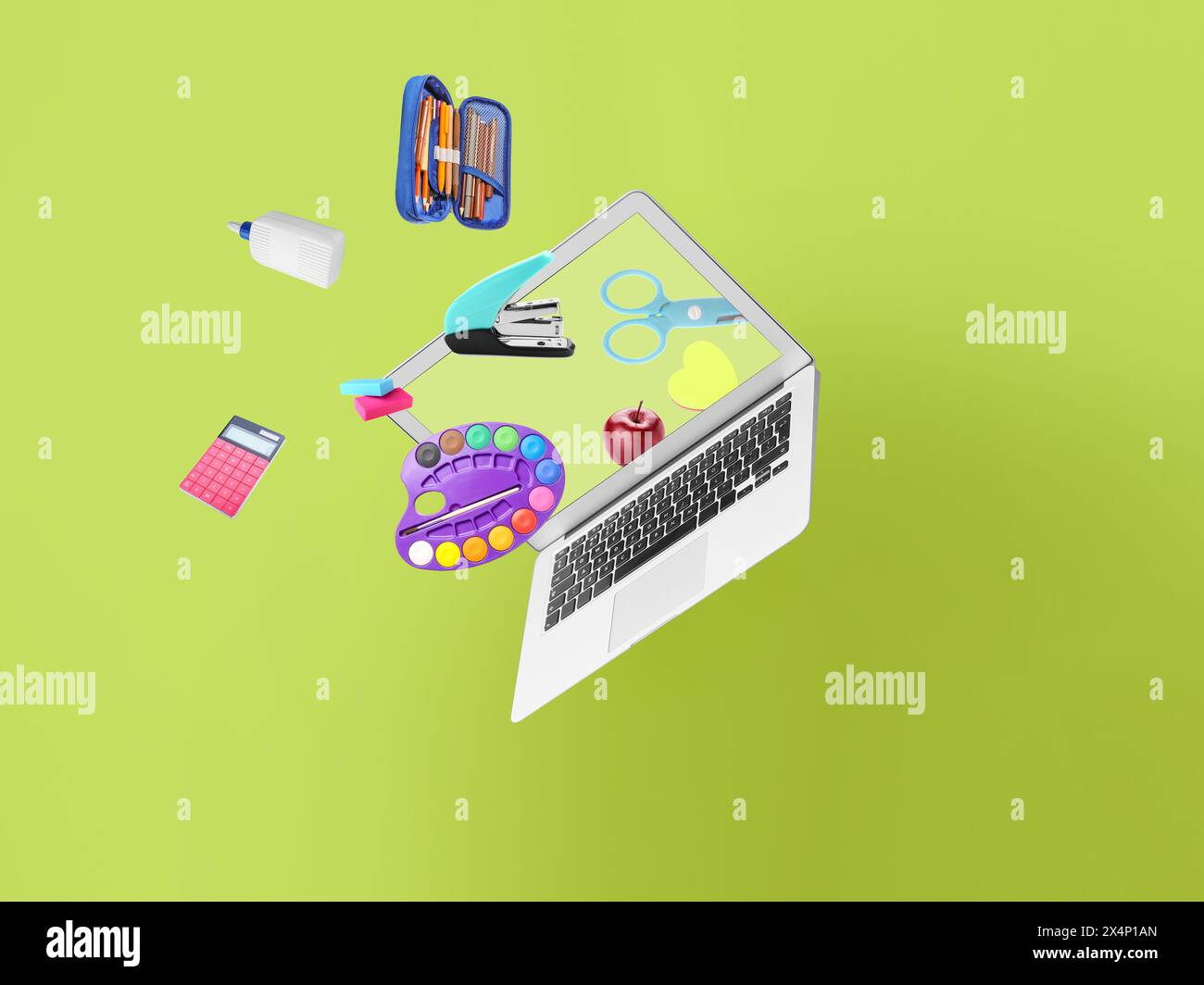 Different flying school supplies and laptop on green background Stock ...
