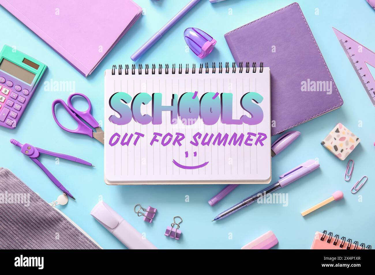 Notebook with text SCHOOLS OUT FOR SUMMER and stationery on light blue ...