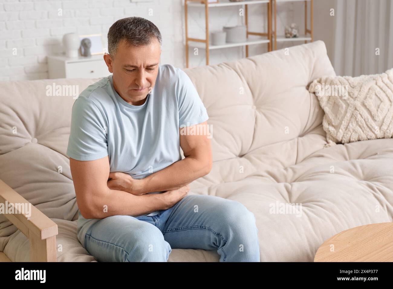 Bellyache man hi-res stock photography and images - Alamy