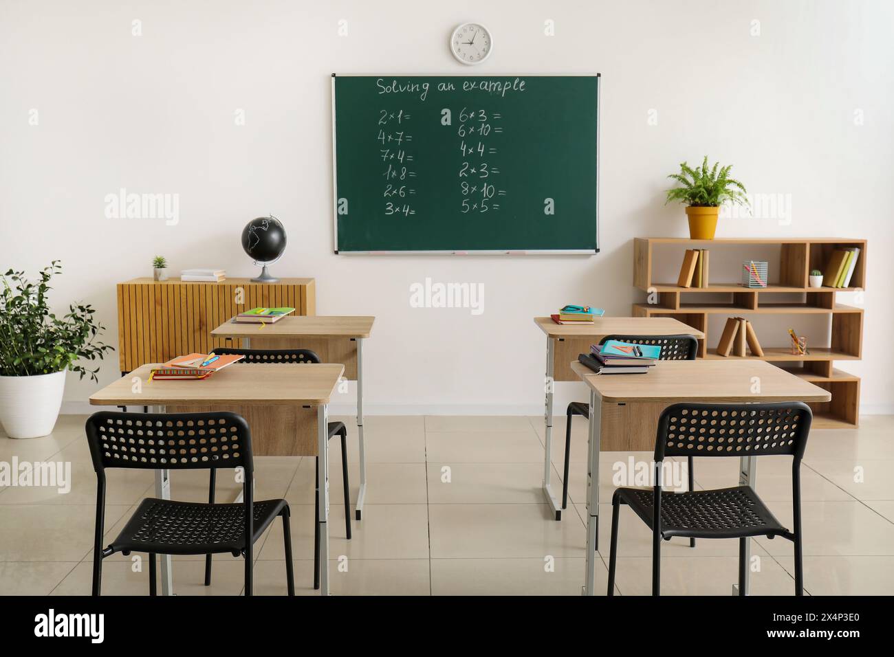 Interior of classroom with blackboard and desks Stock Photo - Alamy