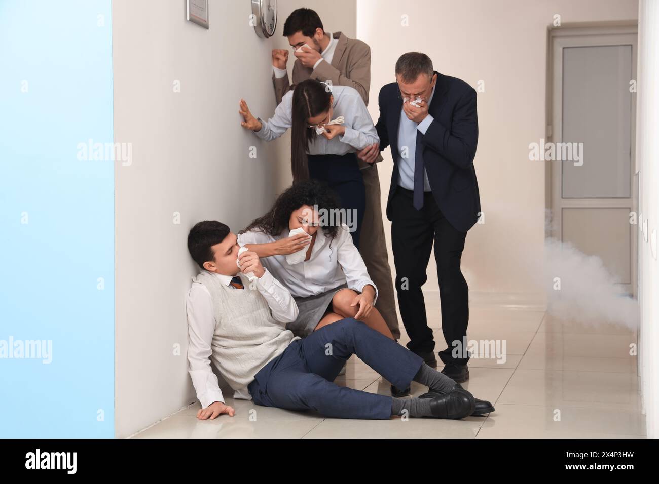 Business people with covered faces choking on smoke in burning office ...