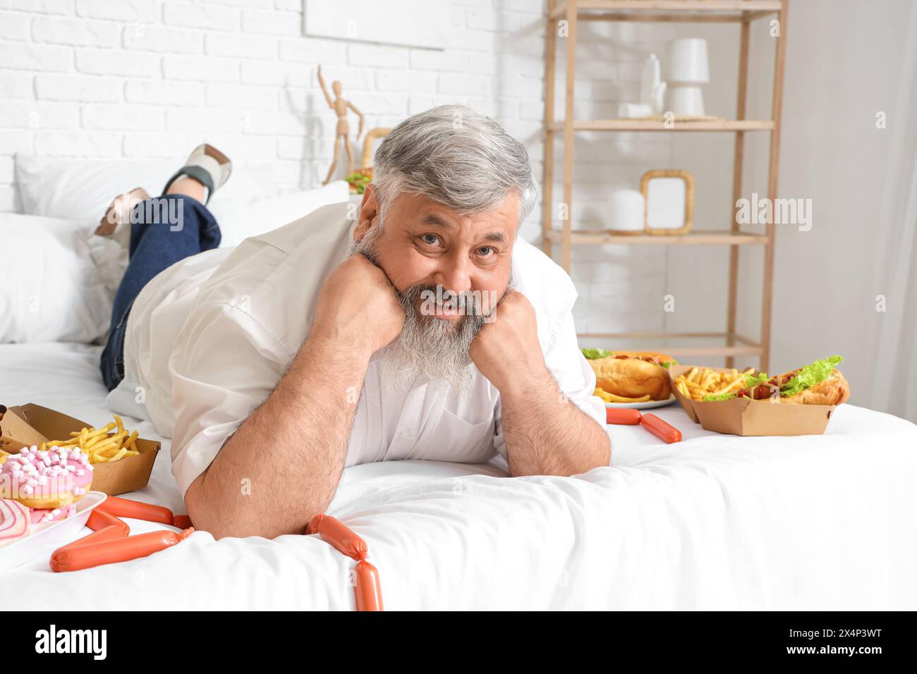 Overweight man bed hi-res stock photography and images - Alamy