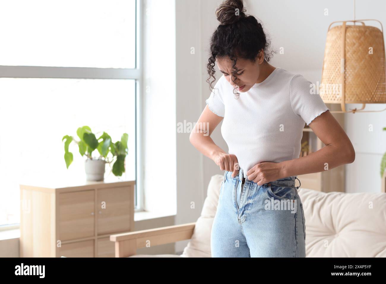 Woman belly button jeans hi-res stock photography and images - Alamy