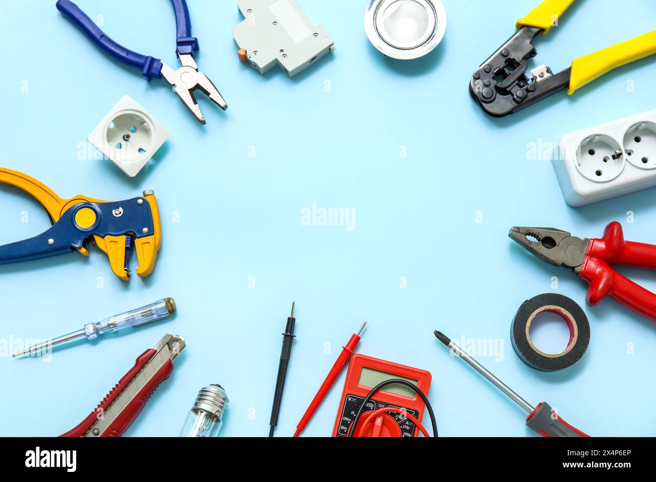 Frame made from electrician's tools on blue background Stock Photo - Alamy