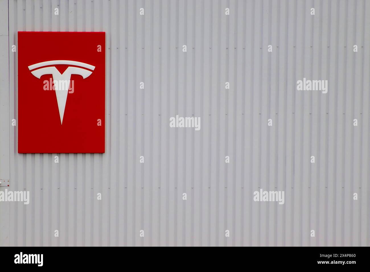 Tesla logo affixed to the exterior of the company’s Southampton vehicle ...