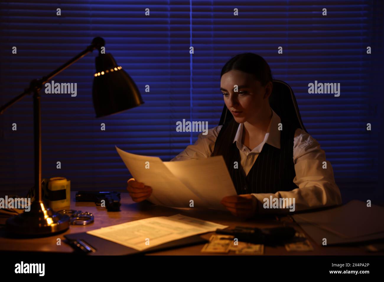 Professional detective working documents hi-res stock photography and ...