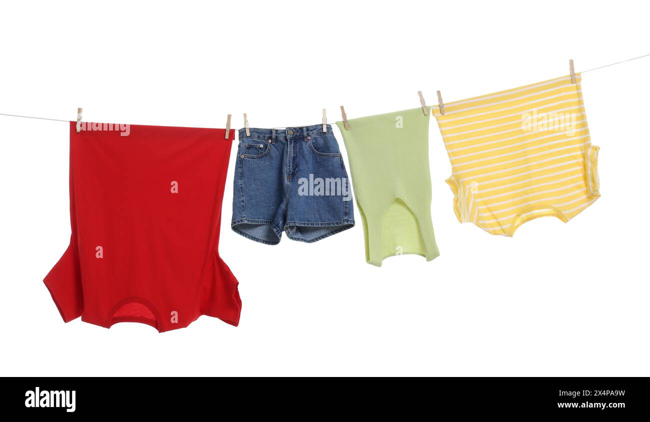 Different clothes drying on laundry line against white background Stock ...