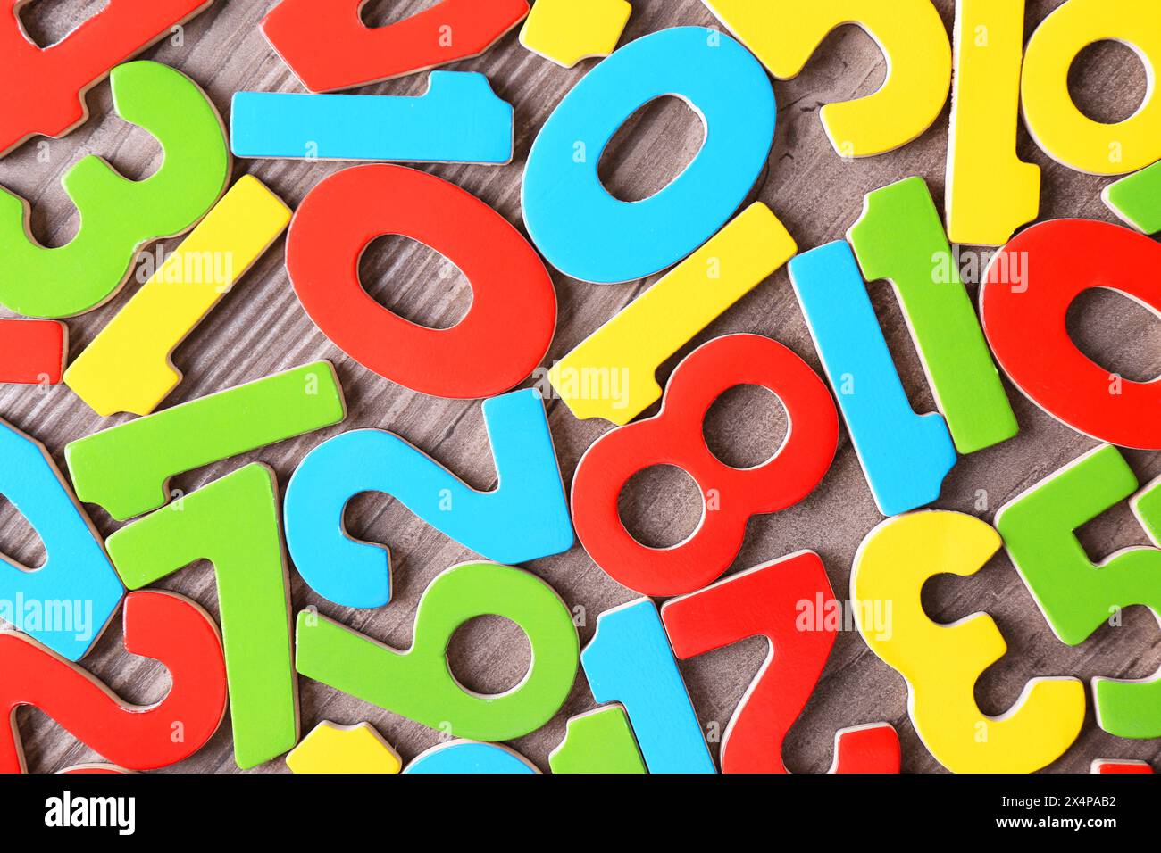 Colorful numbers on wooden school desk, top view Stock Photo - Alamy