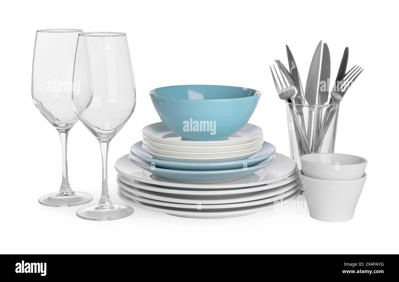Set of beautiful ceramic dishware, glasses and cutlery isolated on ...