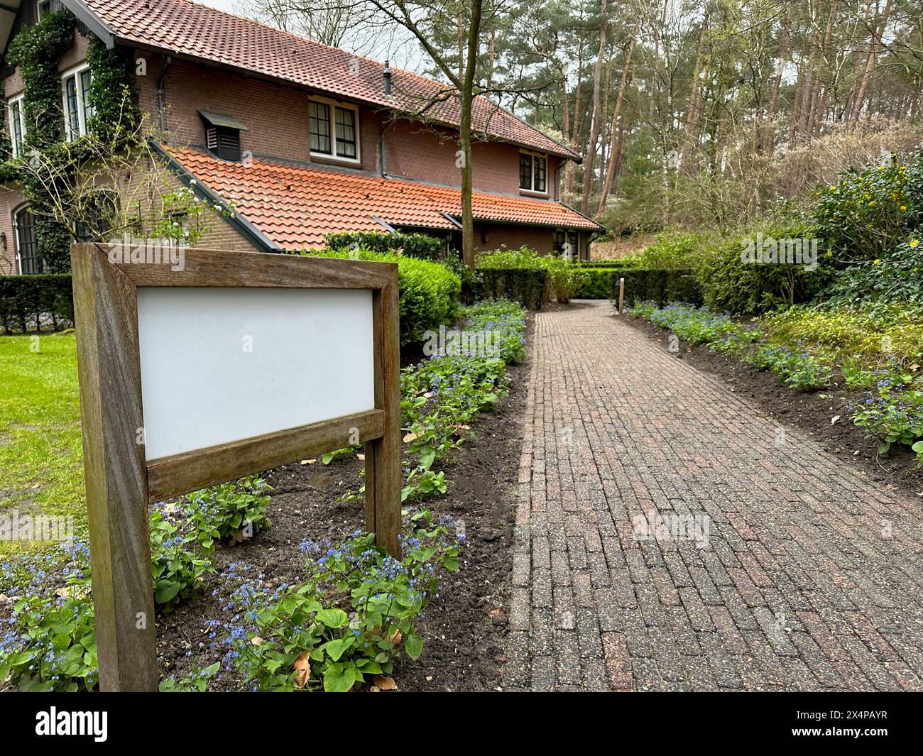 Luxury hotel, pathway and sign board outdoors Stock Photo - Alamy