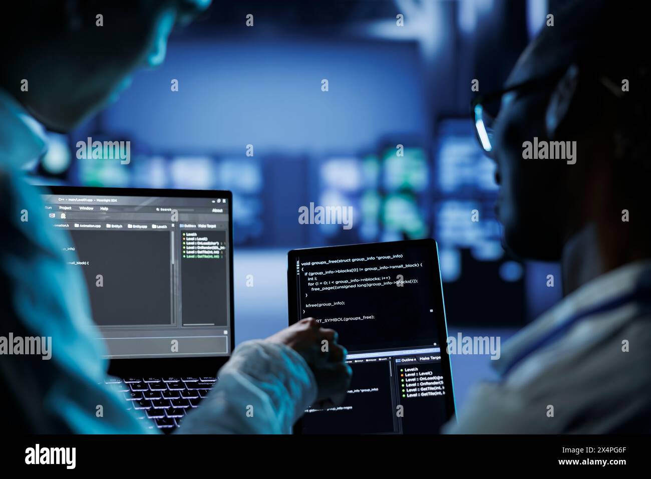 Teamworking colleagues building firewall systems in server room housing advanced infrastructure ...