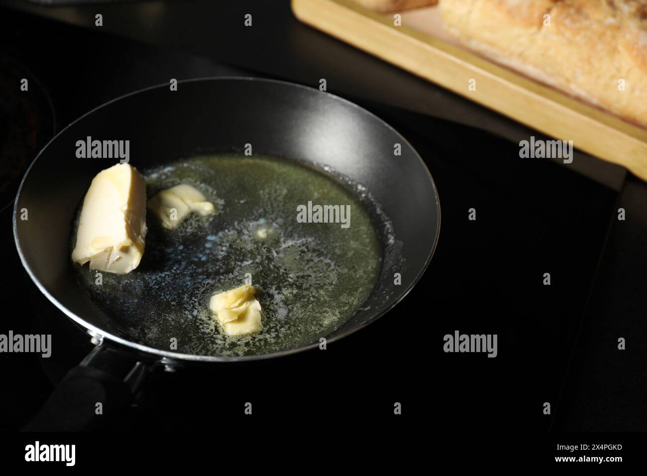 Cooking melting butter on pan hi-res stock photography and images - Alamy