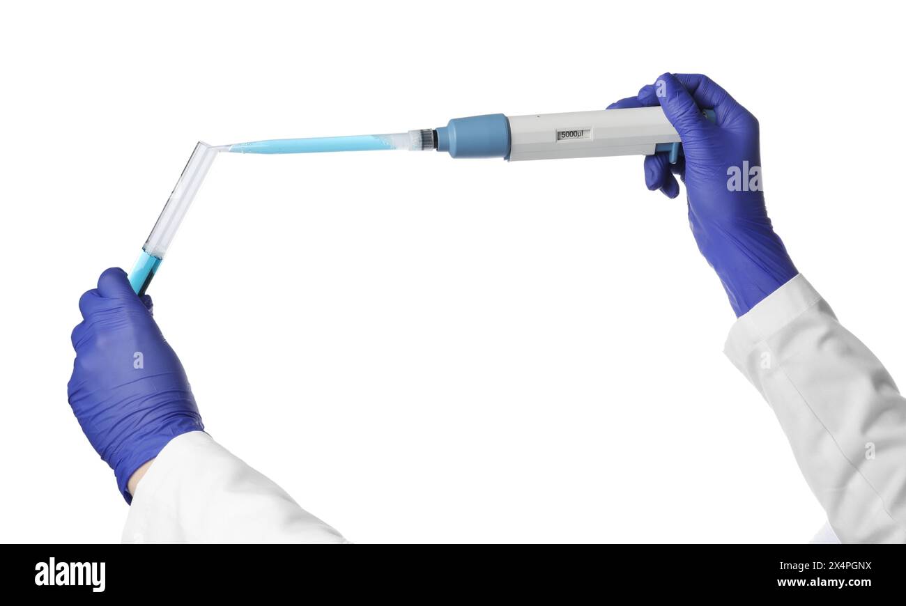 Laboratory analysis. Scientist dripping sample with micropipette into ...