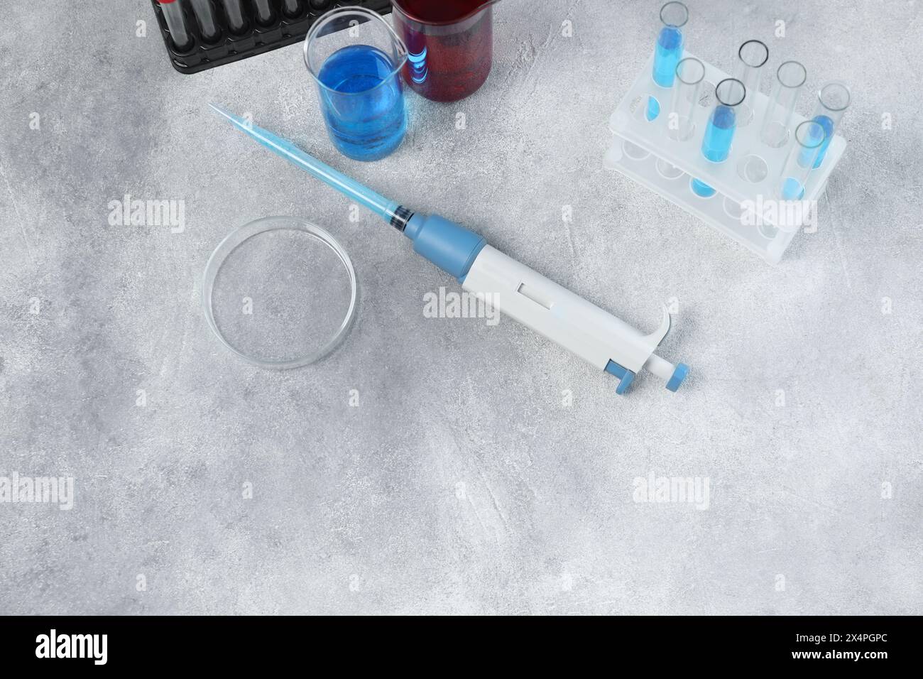 Laboratory analysis. Micropipette, petri dish, beakers and test tubes ...
