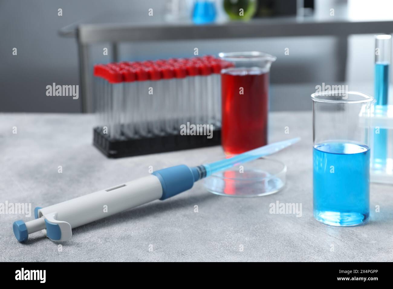Laboratory analysis. Micropipette, petri dish, beakers and test tubes ...