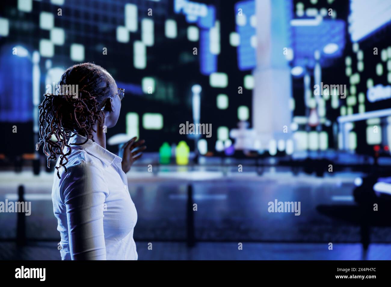 Woman wandering around city boulevards during nighttime, being amazed ...