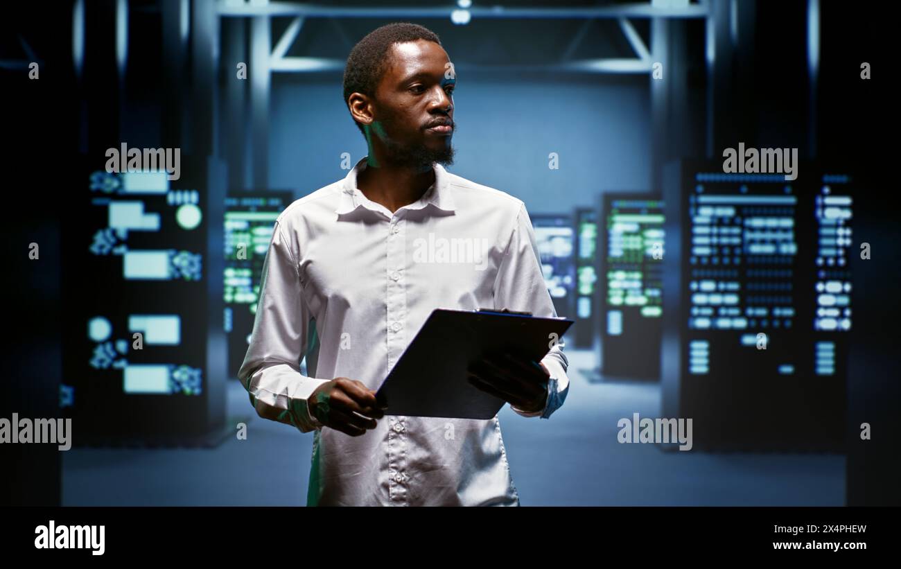 African american engineer doing maintenance in data center providing vast computing resources ...