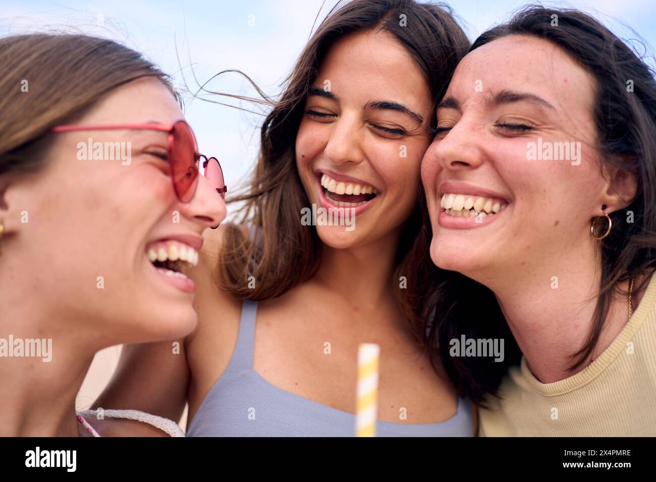 Portrait of group of beautiful laughing gen z European women. Three ...