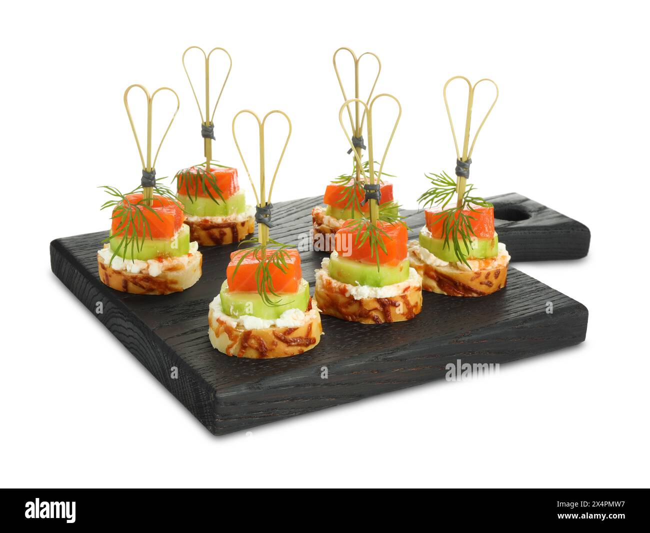 Tasty canapes with salmon, cucumber, bread and cream cheese isolated on ...