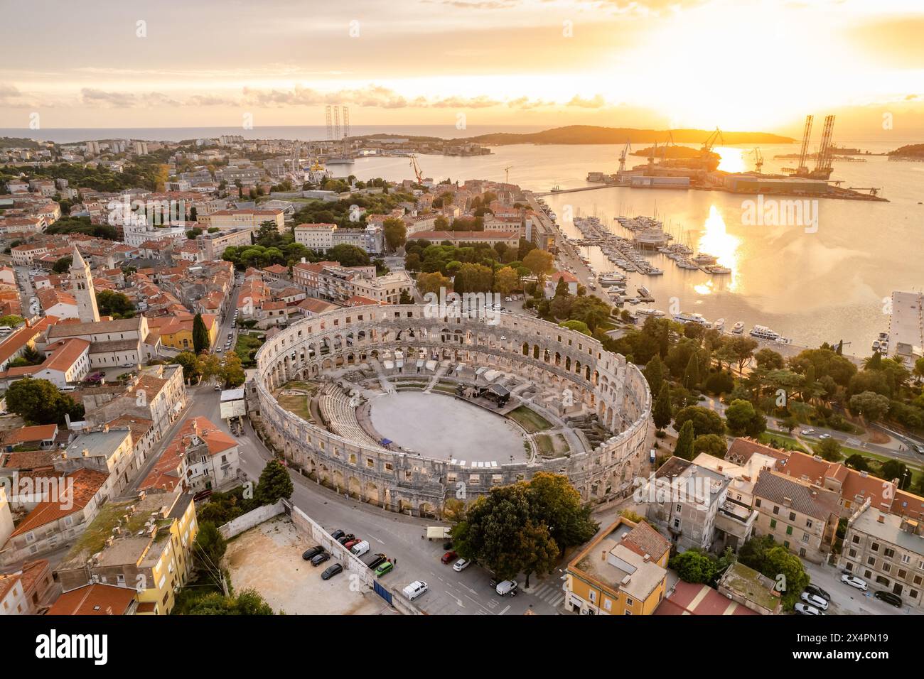 Aerial view of the historic Roman Amphitheatre of Pula at sunset ...