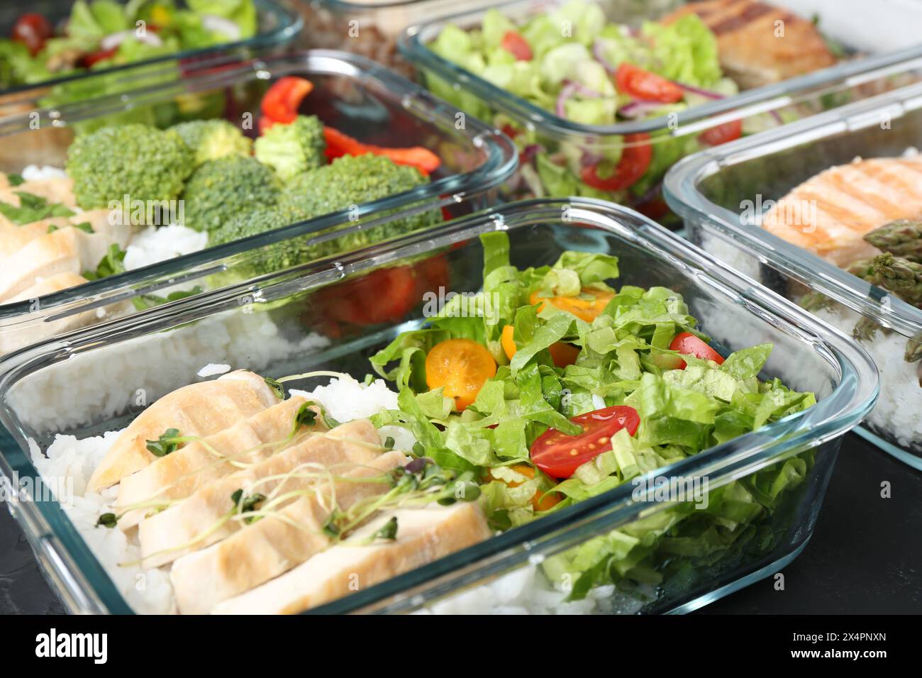 Healthy food. Different meals in glass containers on table, closeup ...