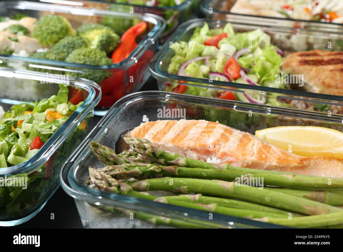 Healthy food. Different meals in glass containers on table, closeup ...