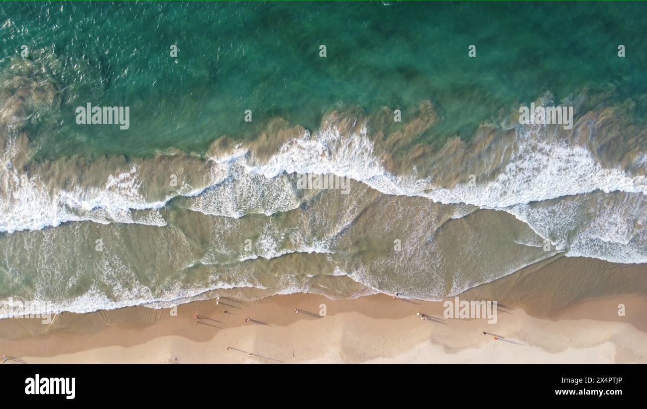 Aerial view of an emerald green sea and big foaming waves. Indian Ocean ...