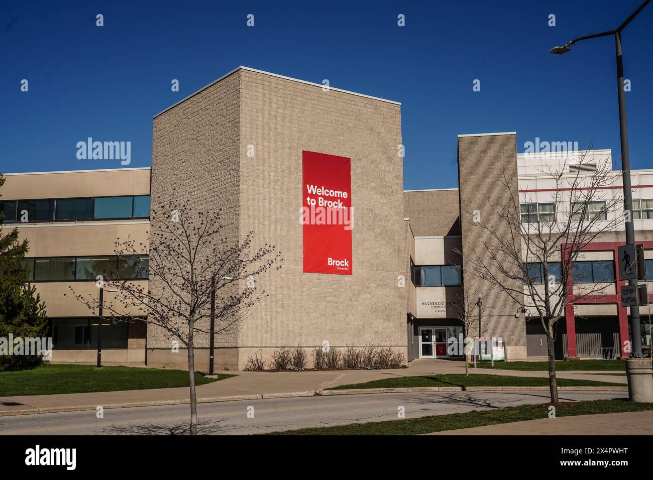 Outdoor red sign welcoming visitors to Brock University, St. Catherine ...