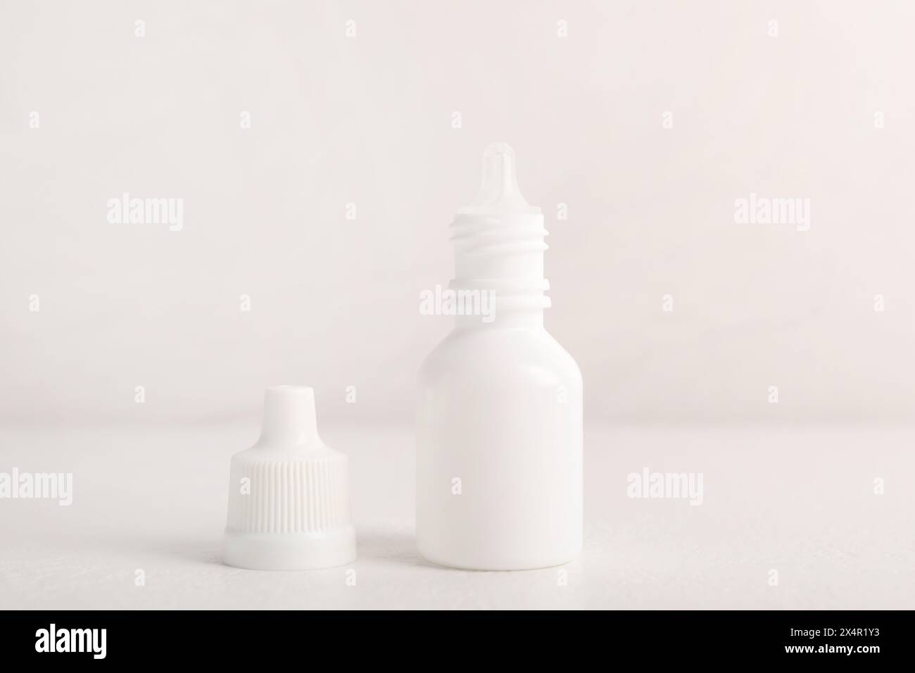 Bottle of medical drops on white background Stock Photo - Alamy