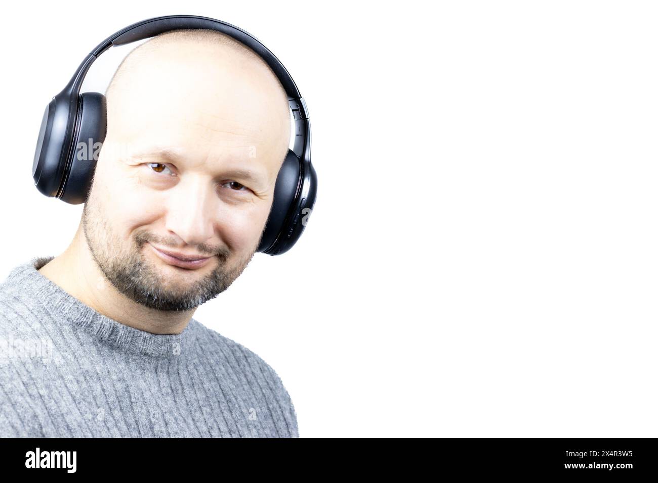 This is a captivating portrait of a man, set against a stark white ...