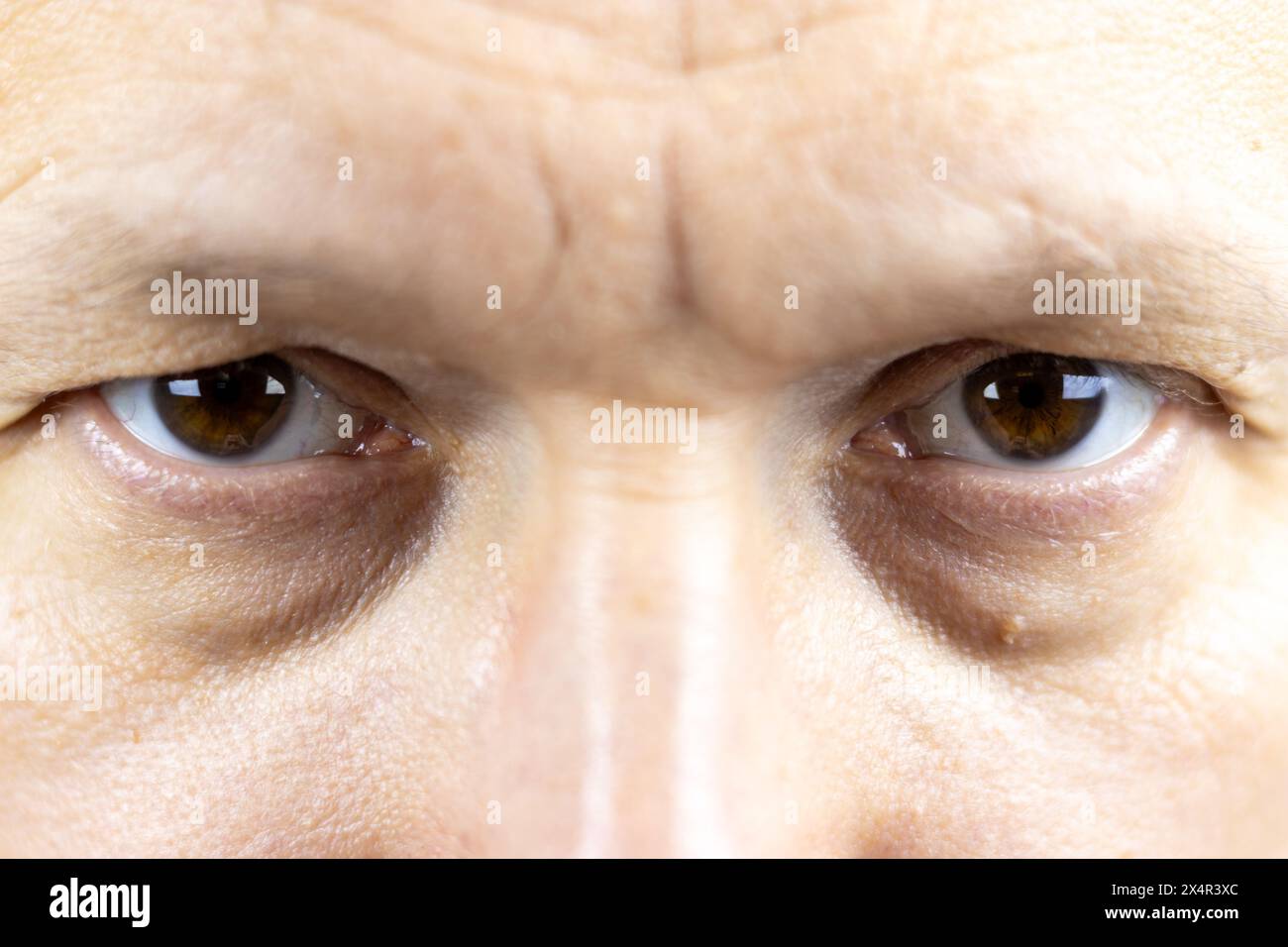 This image captures the intense and expressive eyes of a 45-year-old ...