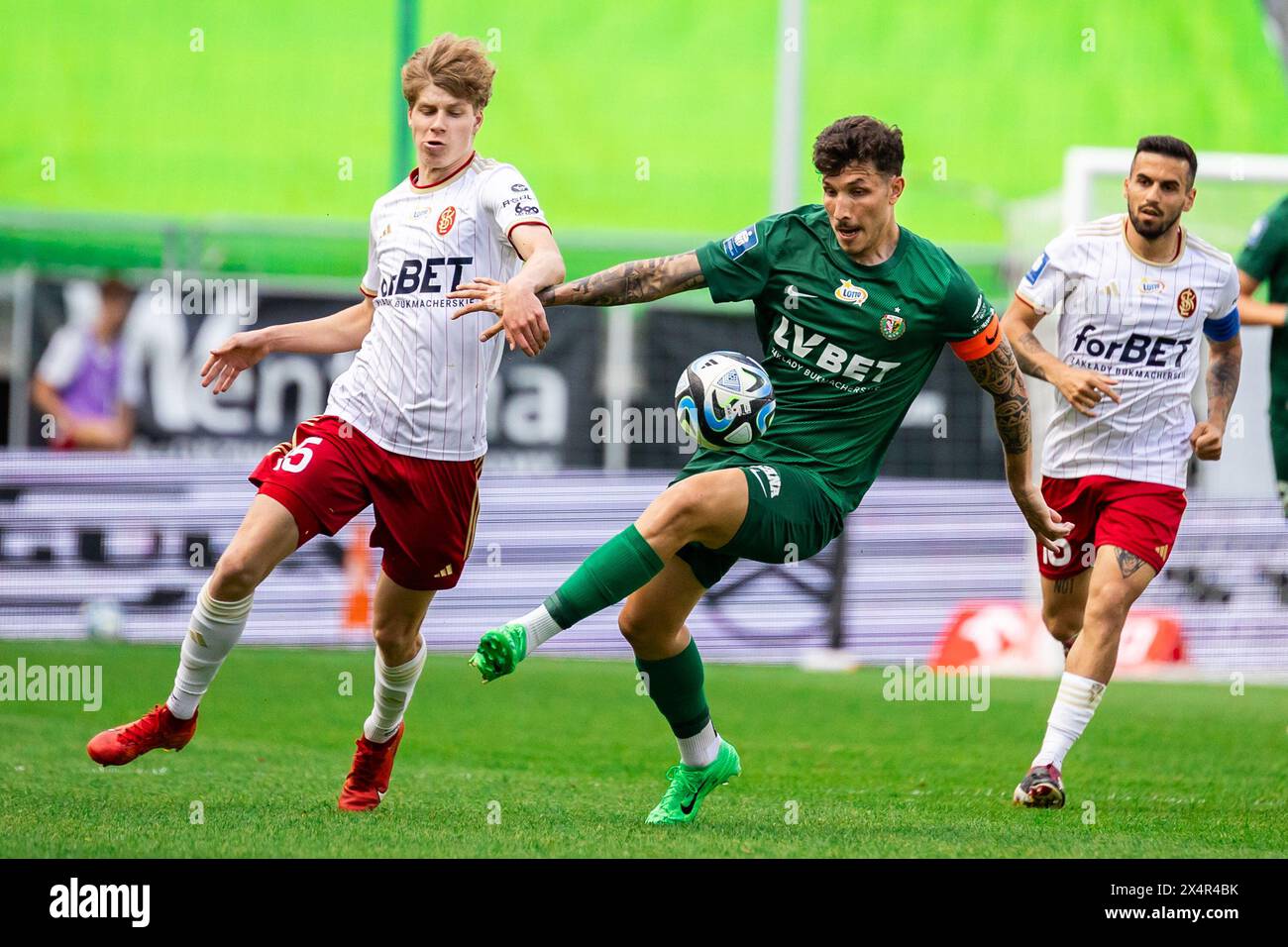 Antoni Mlynarczyk (L) of LKS, Erik Exposito (C) of Slask, Dani Ramirez ...