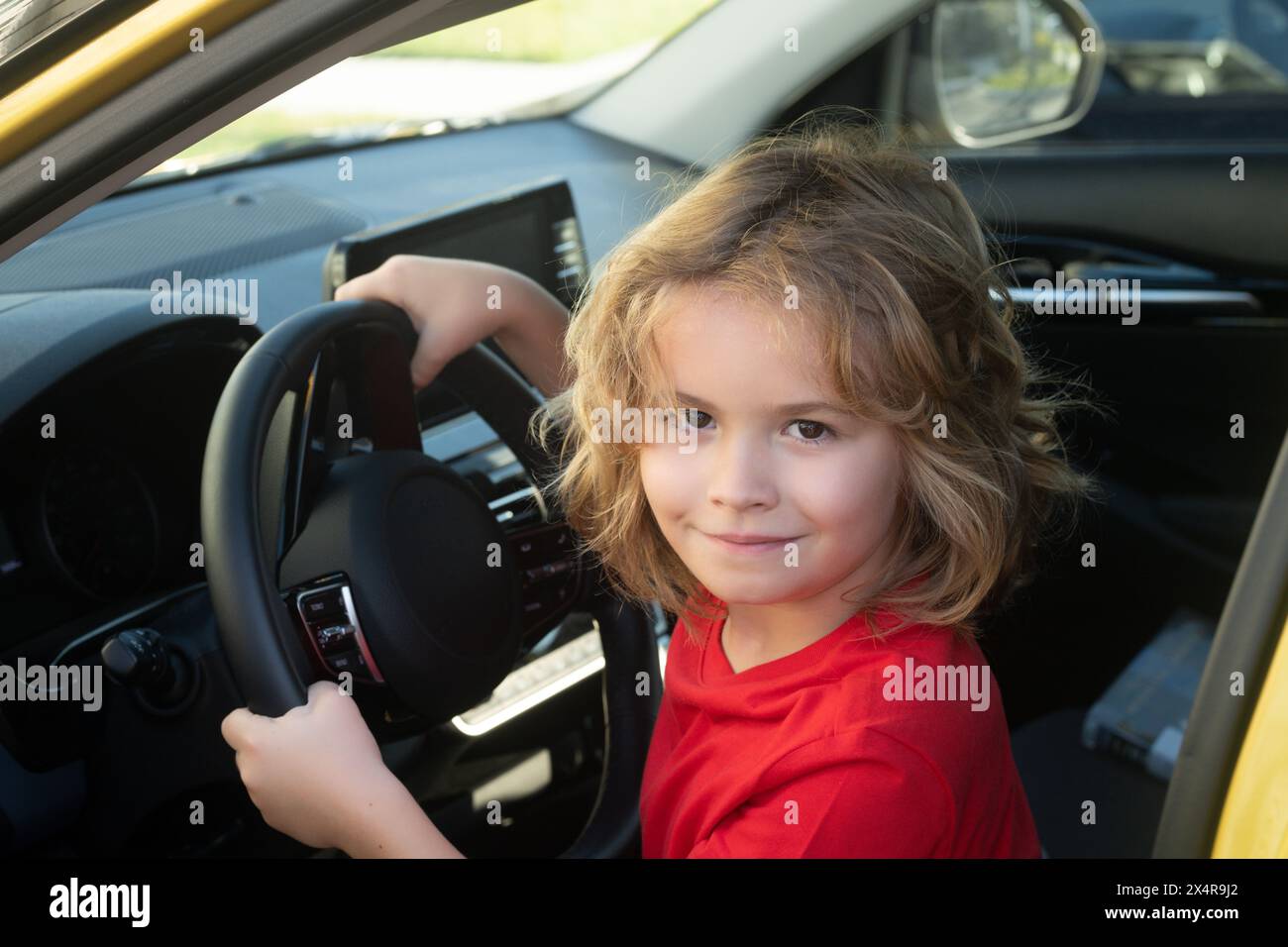 Little Driver. Cute little boy pretending to drive. Little kid driving ...