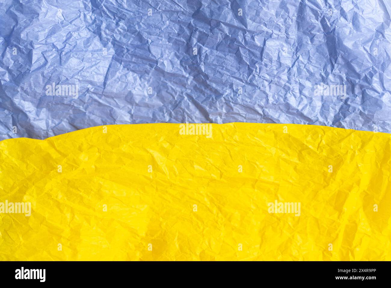 Paper in blue and yellow colors of the flag of Ukraine, UA. Blue and ...