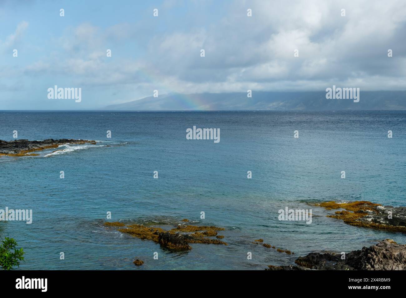 Beautiful panoramic Kapalua Bay vista with a rainbow over the Molokai ...