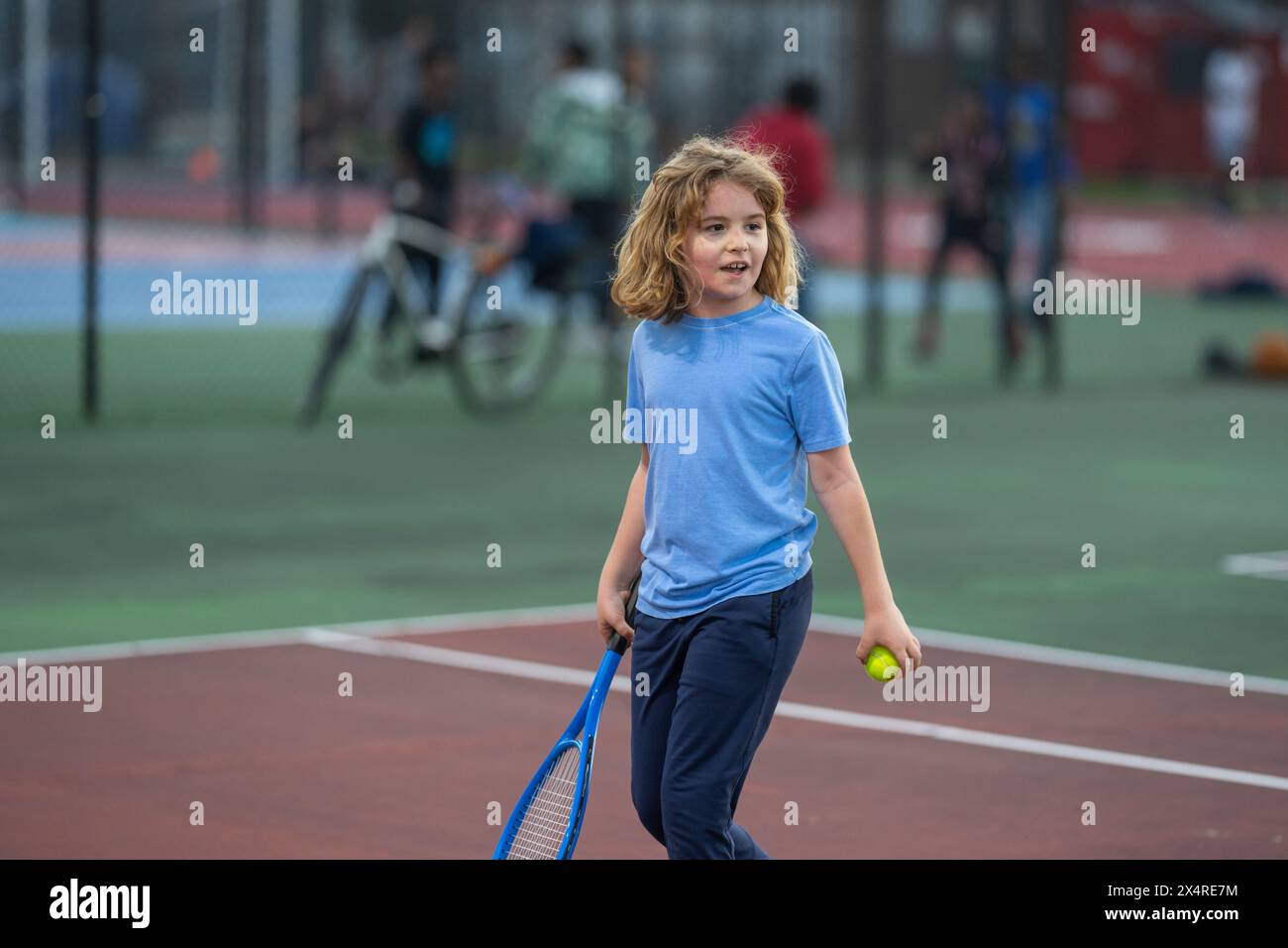 Cute kid playing the tennis on court Stock Photo - Alamy