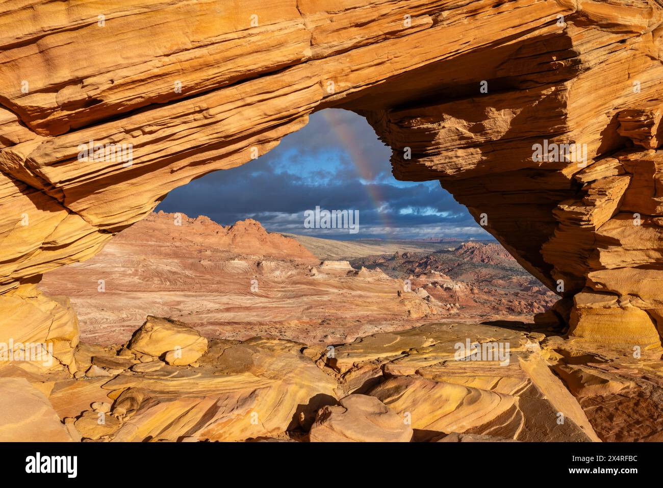 Top Rock Arch at Marble Canyon with sunrise rainbow near The Wave ...