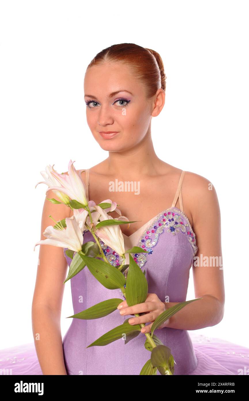 calm red-haired ballet dancer with lily, isolated on white Stock Photo ...