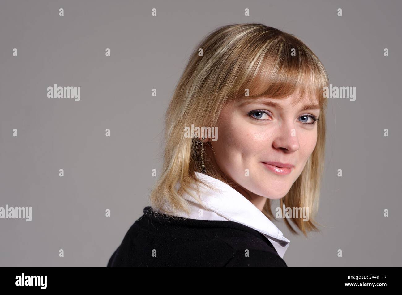 Young woman sly smile portrait hi-res stock photography and images - Alamy