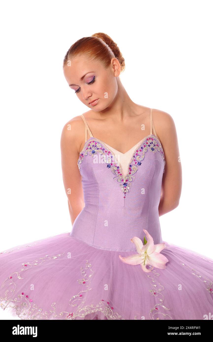 calm red-haired ballet dancer with lily isolated on white Stock Photo ...