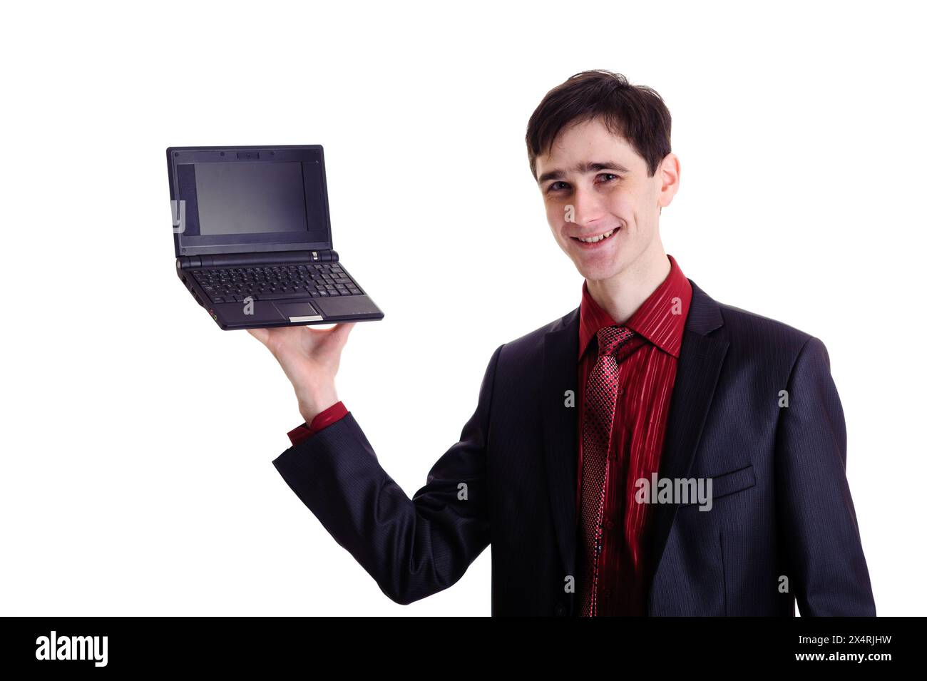 businessman hold black netbook on arm like waiter, isolated on white ...