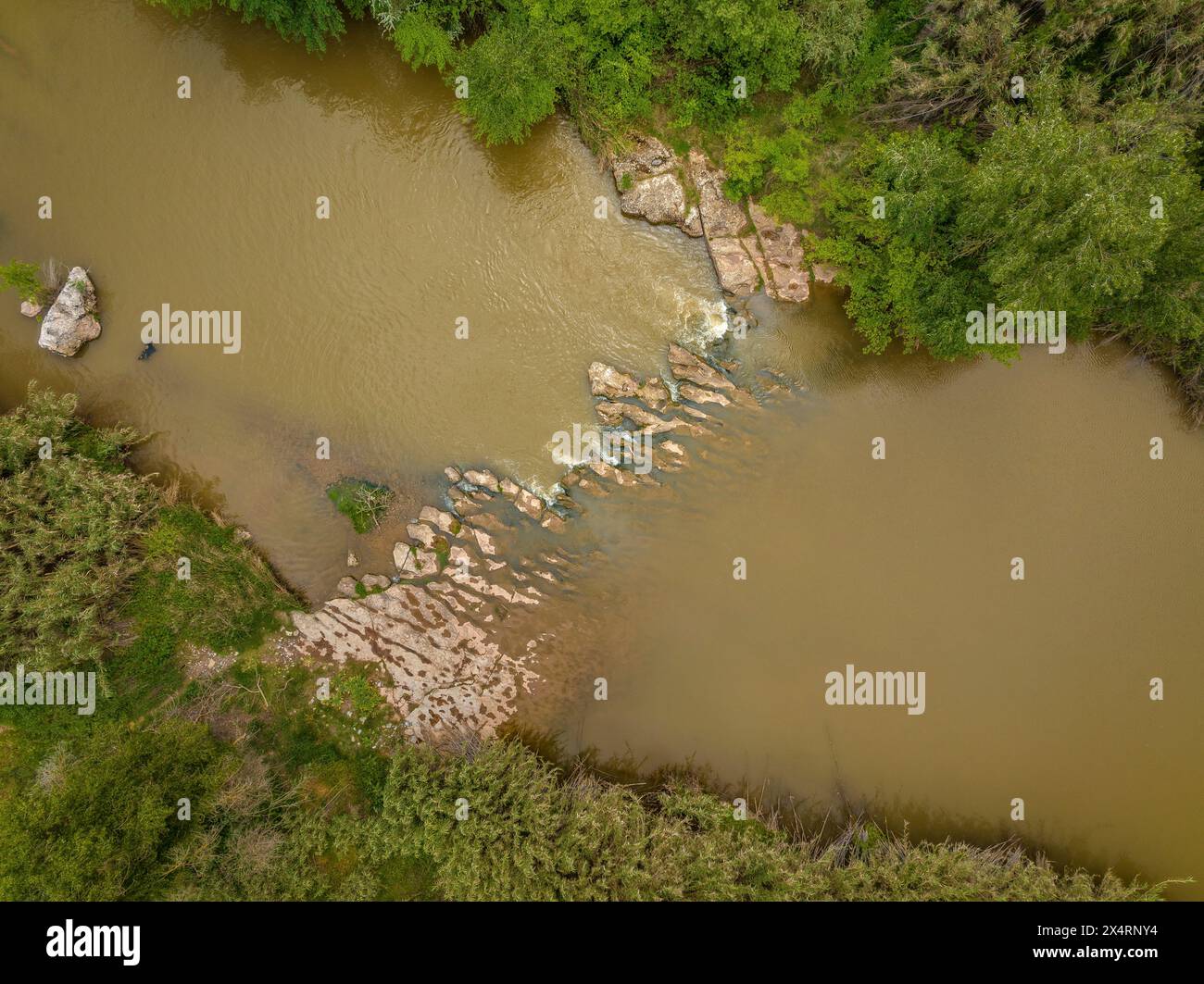Aerial view of the Llobregat river as it passes through Sant Fruitós de ...