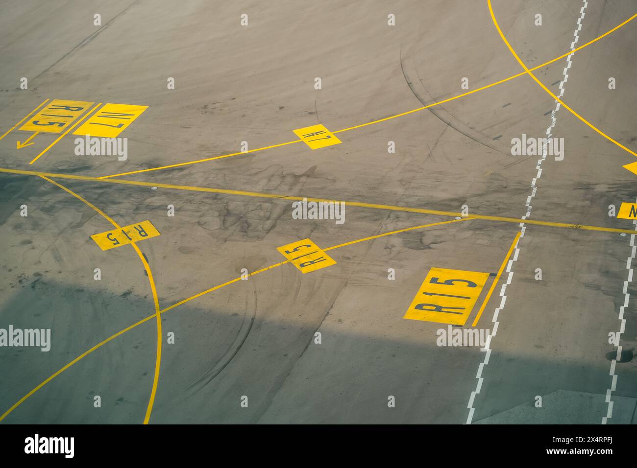 Aerial top view of a commercial airport runway with connections and ...
