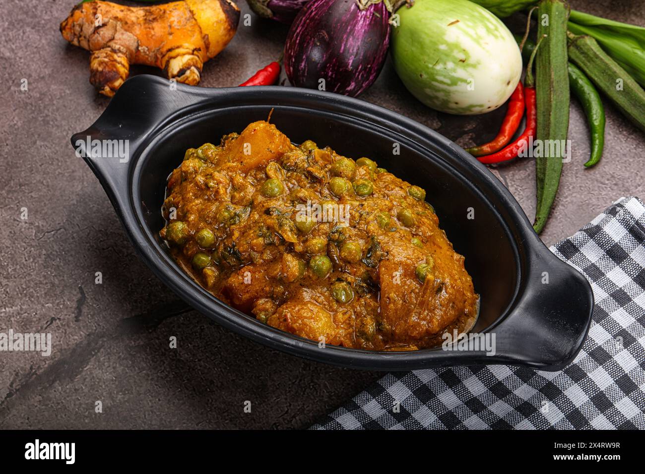 Indian traditional cuisine Aloo mutter - potato with green peas Stock ...