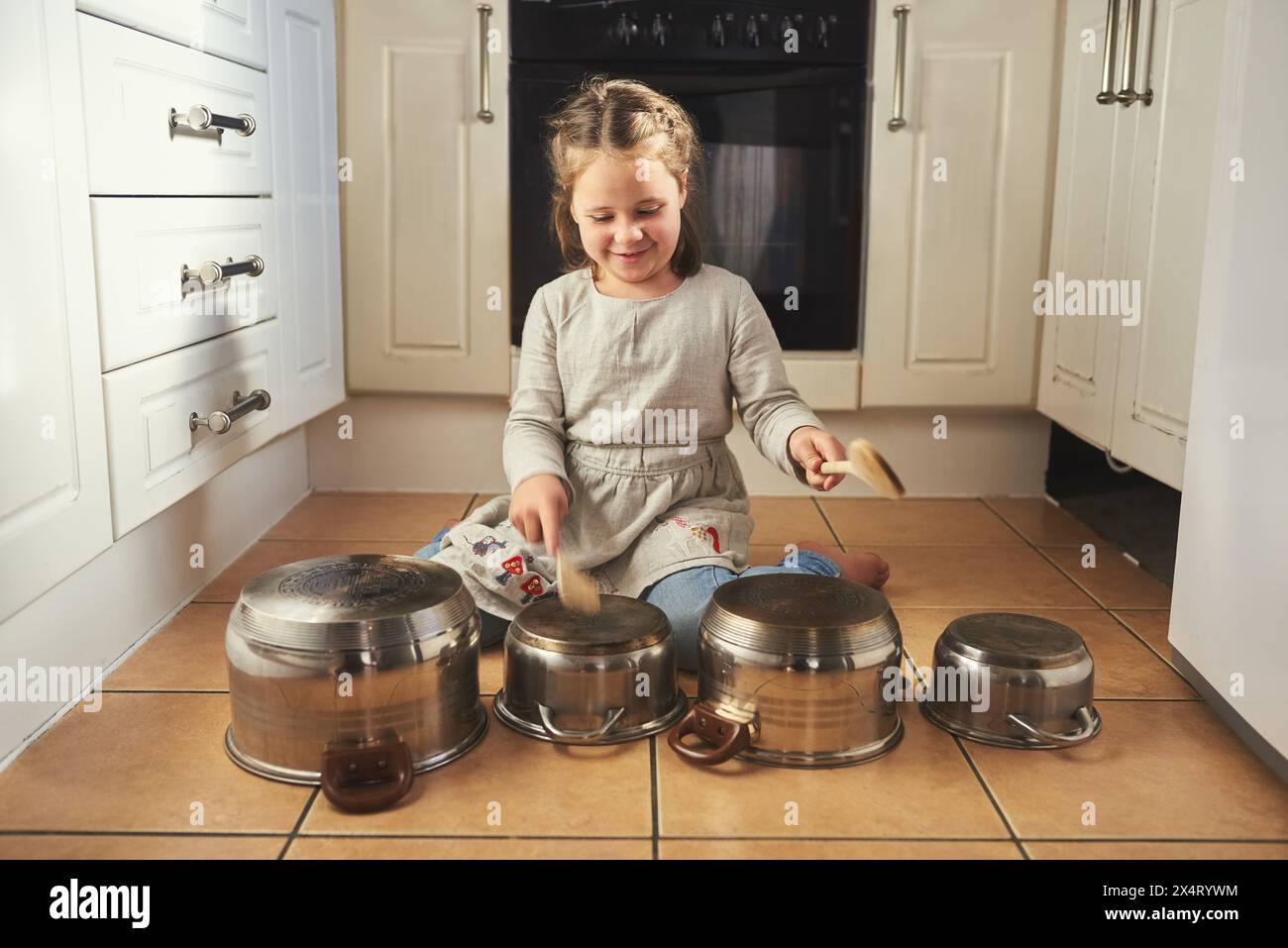 Home, instrument and child drums with music in kitchen and creativity ...