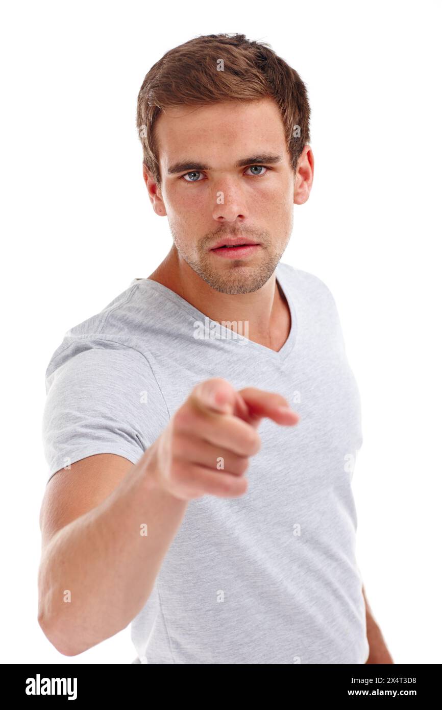 Pointing, serious and portrait of man on a white background for problem ...