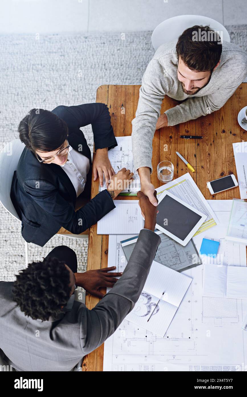 Above, business people and handshake after meeting or presentation ...