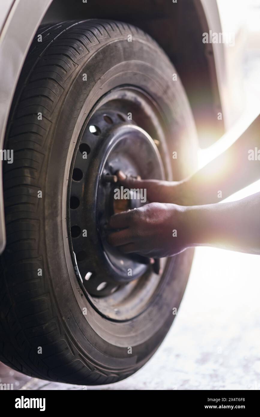 Hands replace tires on wheels hi-res stock photography and images - Alamy