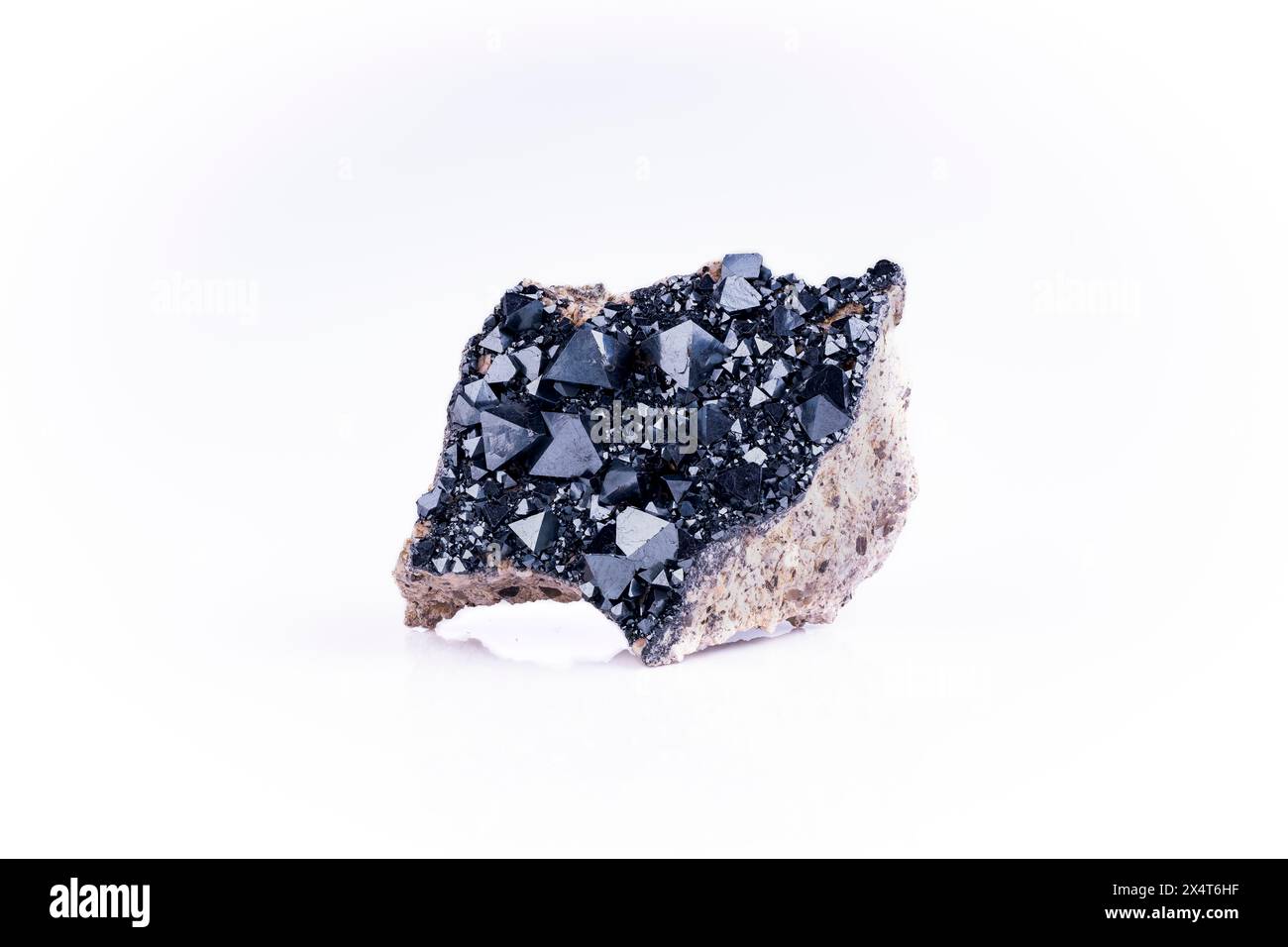 Magnetite crystals on feldspar photography isolated on white ...