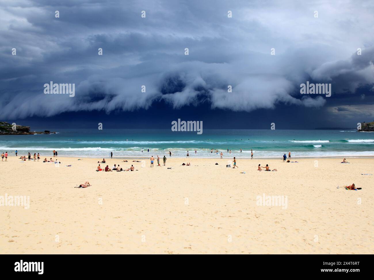 Bondi Beach - Sydney Australia. Beach goers enjoy the last rays of ...